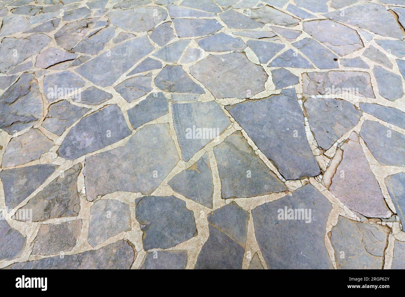 gray stone ground in a park, looks very old Stock Photo - Alamy
