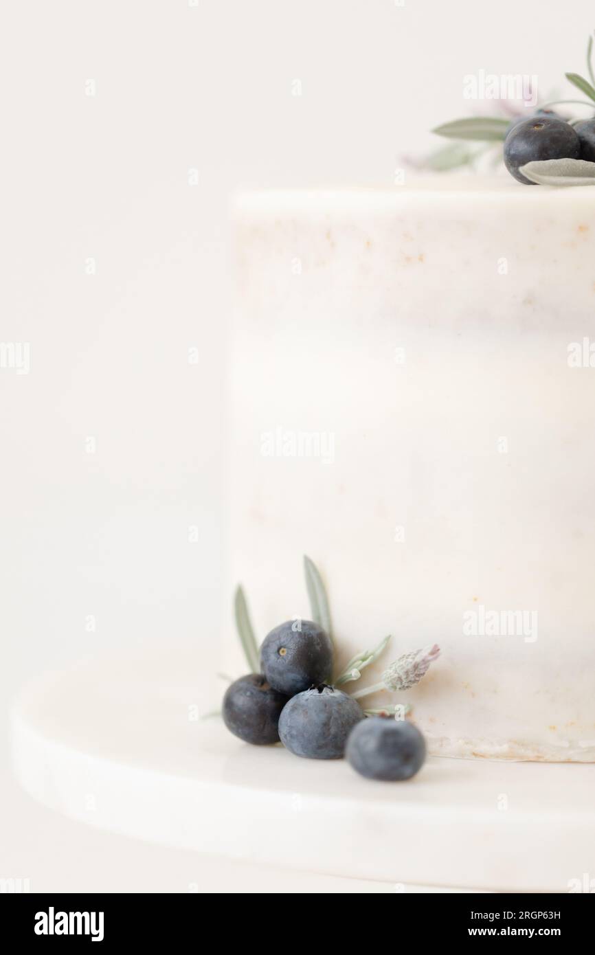 natural white cake with blueberry lavender garnish Stock Photo - Alamy