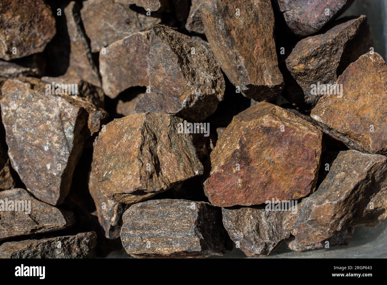 Bronzite gemstone as natural mineral rock Stock Photo - Alamy