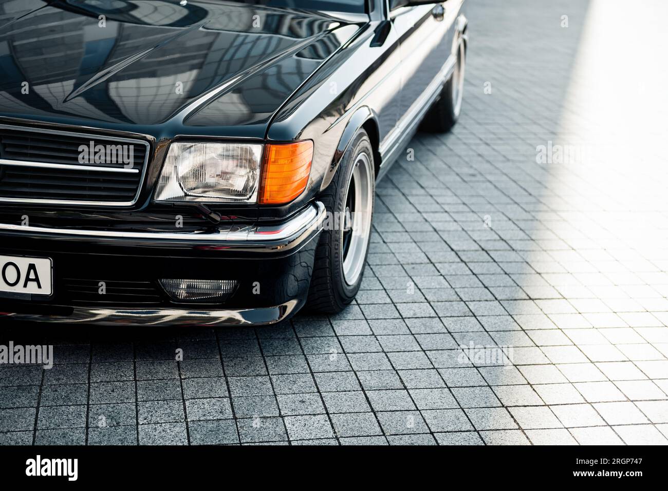 classic black Mercedes-Benz W126. Front corner view of luxury Mercedes ...