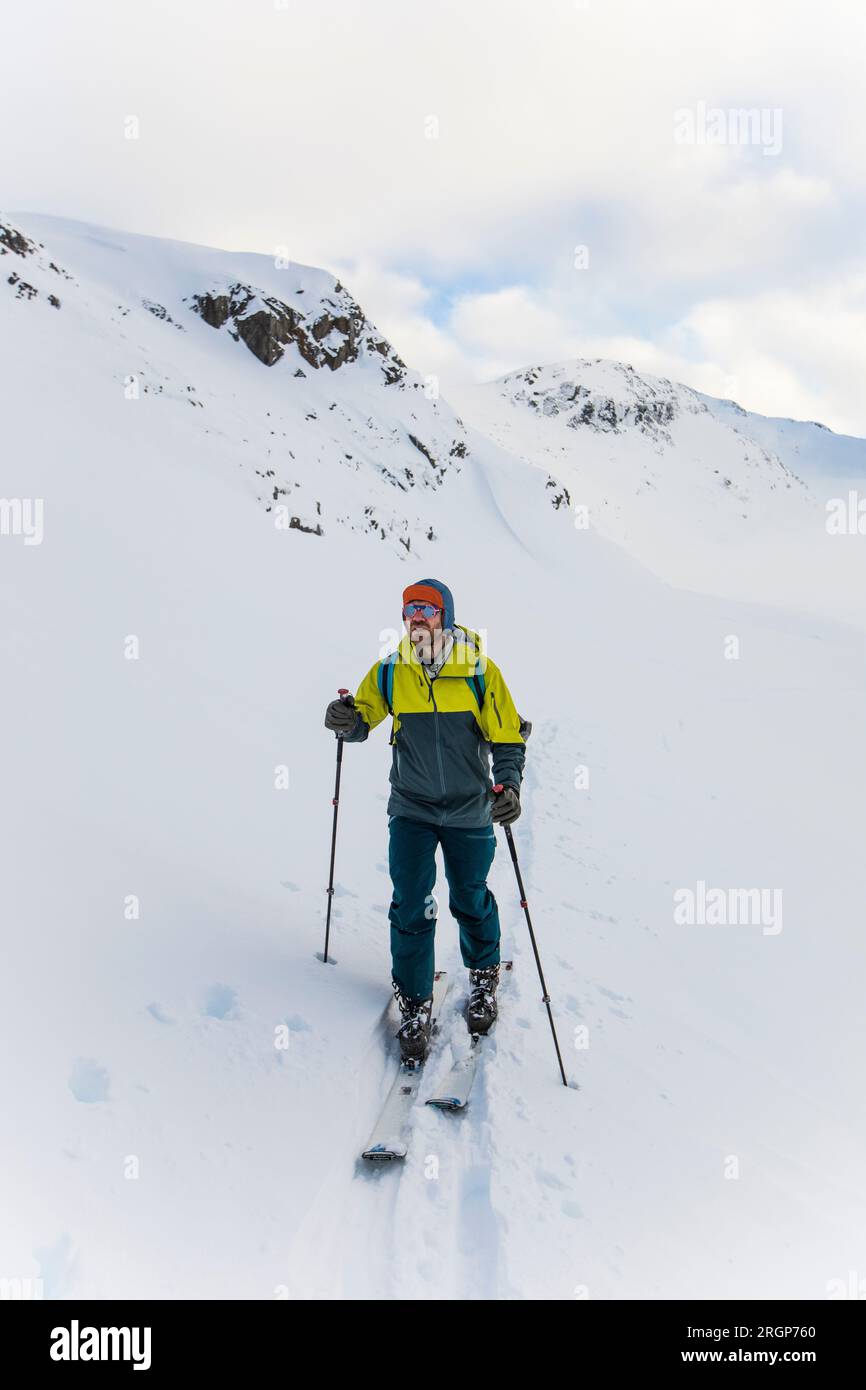 Ski tourer on the move, skinning up a mountain during ski trip Stock ...