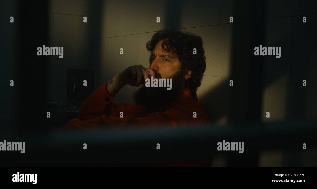 Prisoner smoking cigarette cell hi-res stock photography and images - Alamy