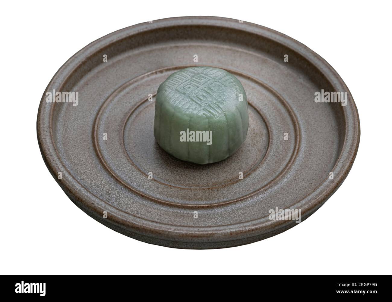 Delicious green mooncake is filled with taro, black sesame and golden ...