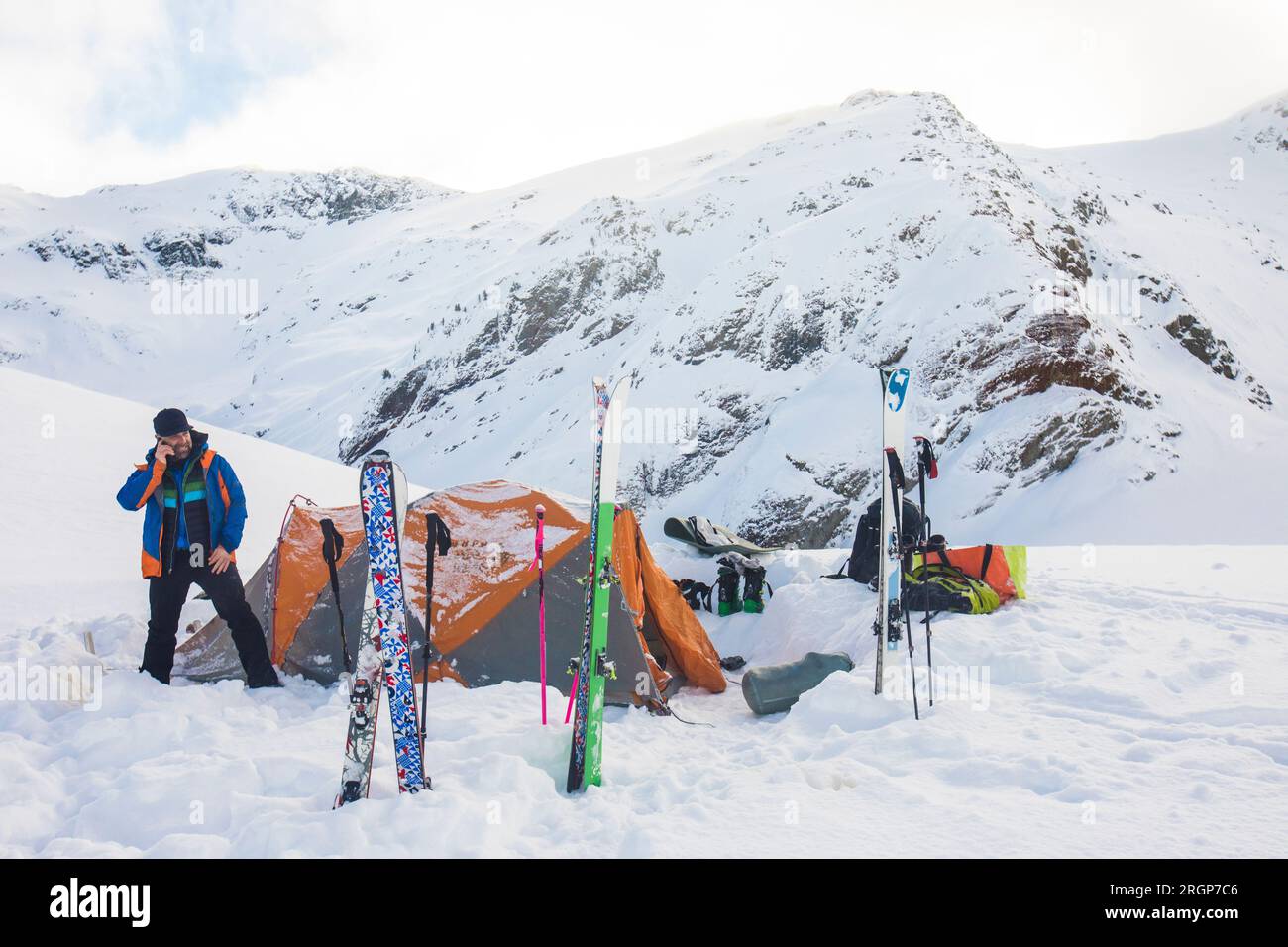 adventurous man on sat phone calling helicopter for pick up Stock Photo ...