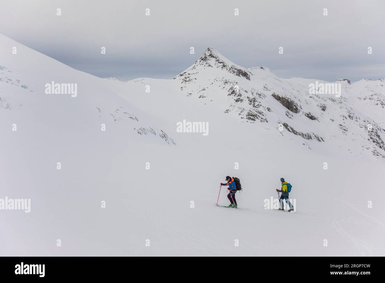 Side view of two skiers backcountry skiing in B.C Stock Photo - Alamy