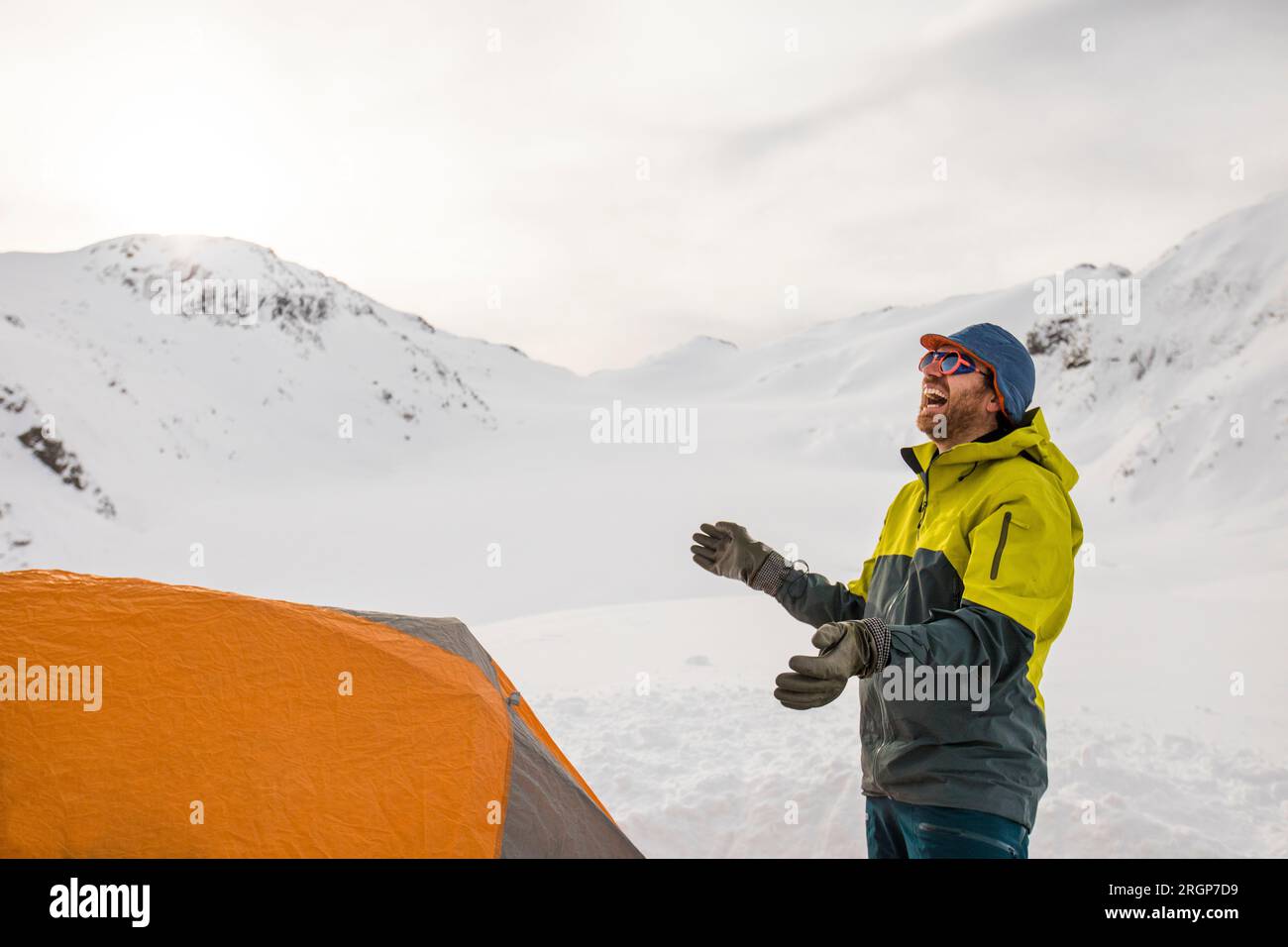 Mountain man and explorer, belly laughs at joke while camping Stock ...