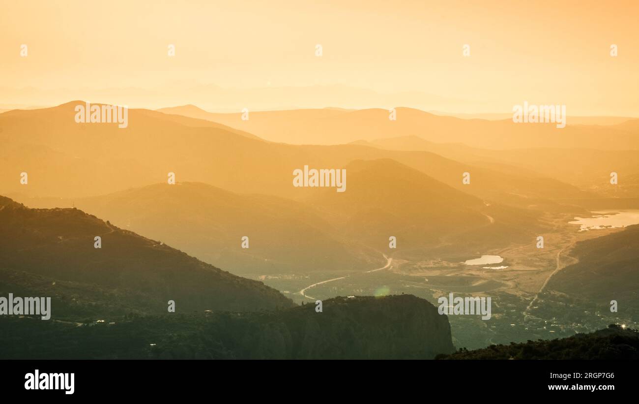 View from Lasithi plateau at sunset. Warm toned photo of mountains of ...