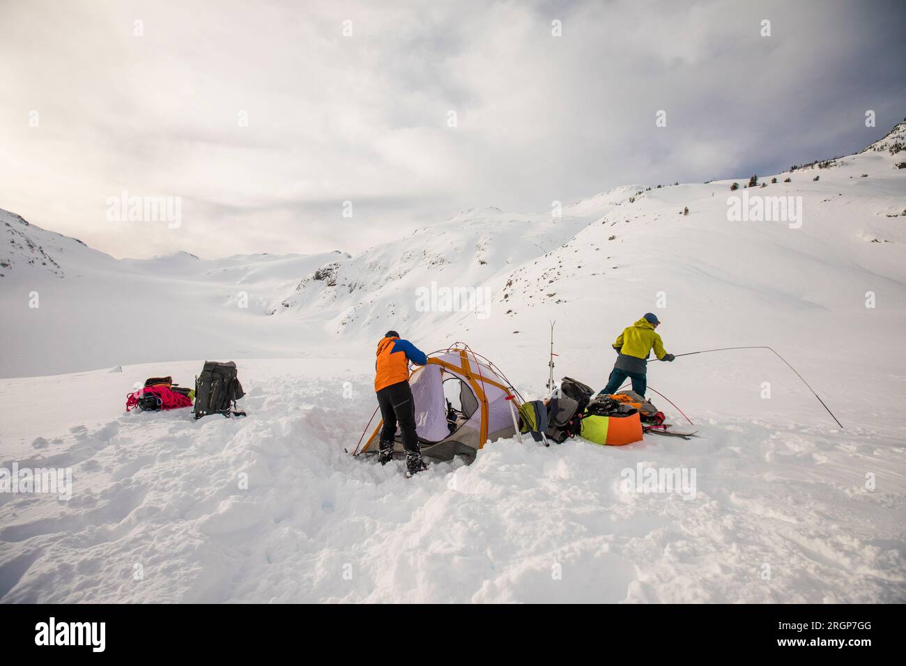 Mountaineers setup tent in remote mountain location Stock Photo - Alamy