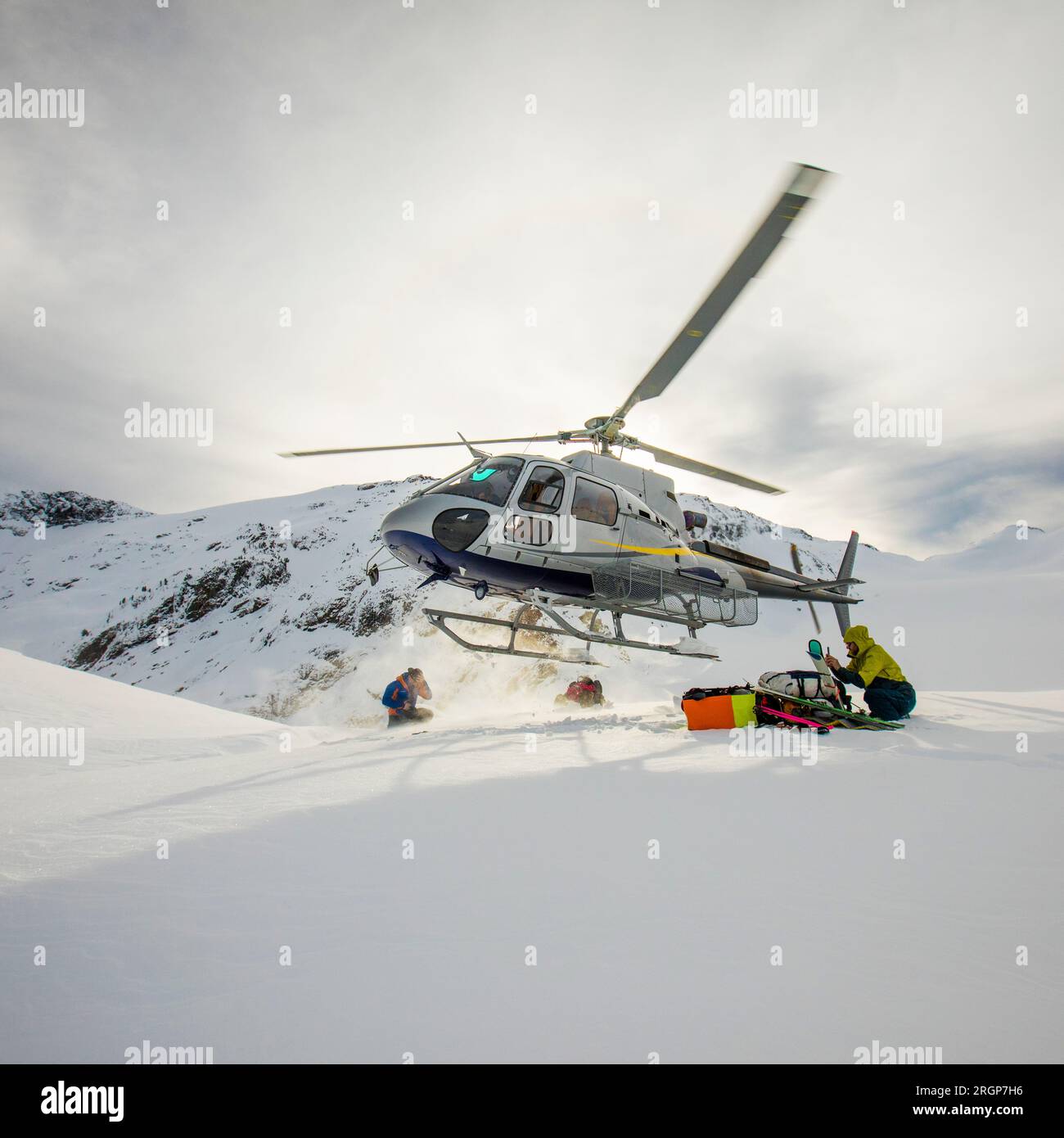 Square crop of helicopter lifting off in winter conditions Stock Photo ...