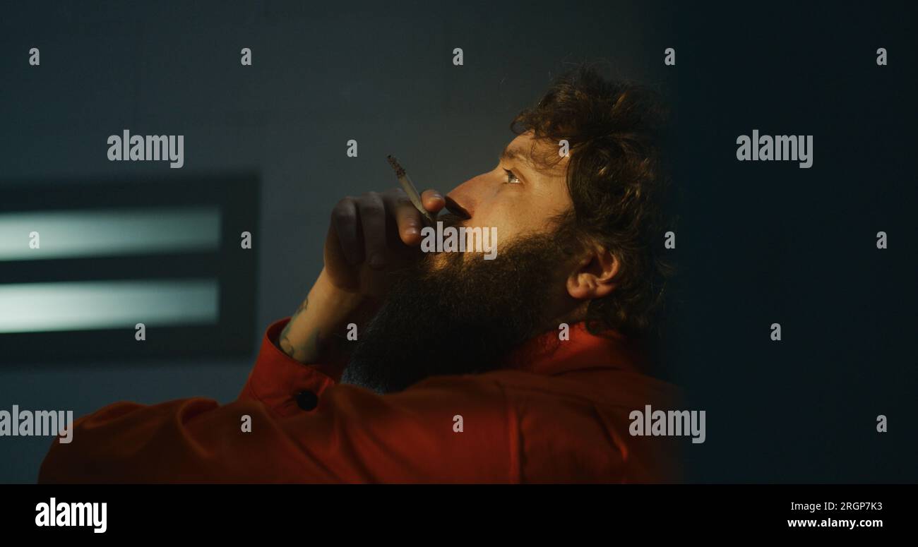 Prisoner smoking cigarette cell hi-res stock photography and images - Alamy
