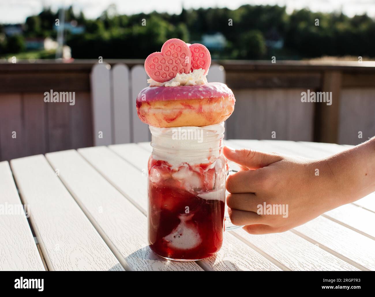 deluxe sundae milkshake with ice cream donut and heart wafers Stock ...