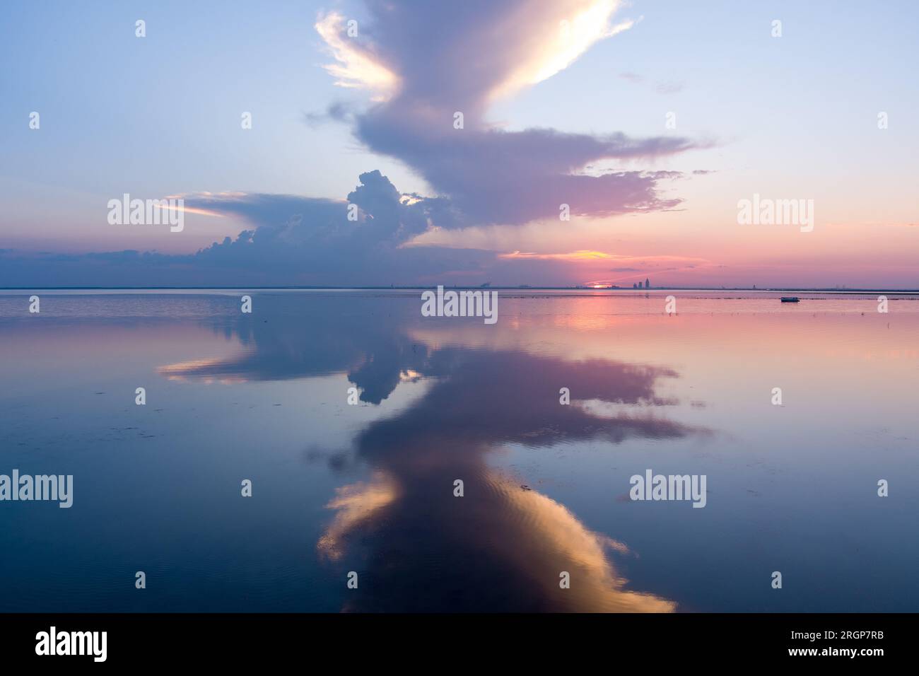 Reflective sunset on the bay Stock Photo - Alamy