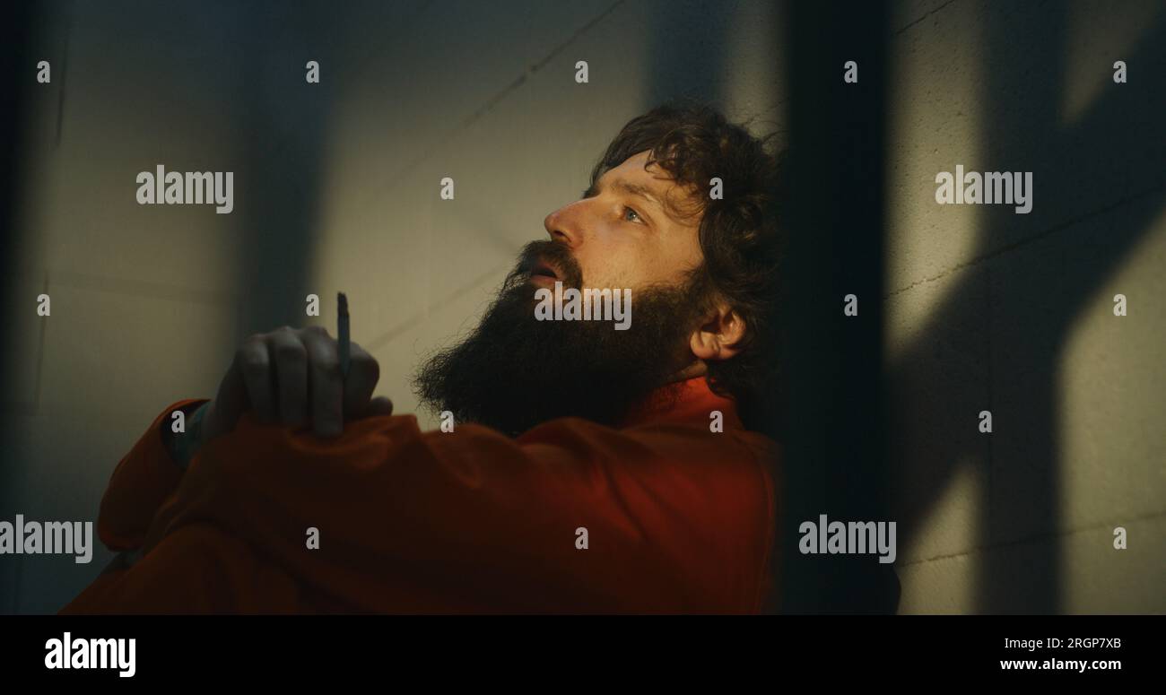 Prisoner smoking cigarette cell hi-res stock photography and images - Alamy