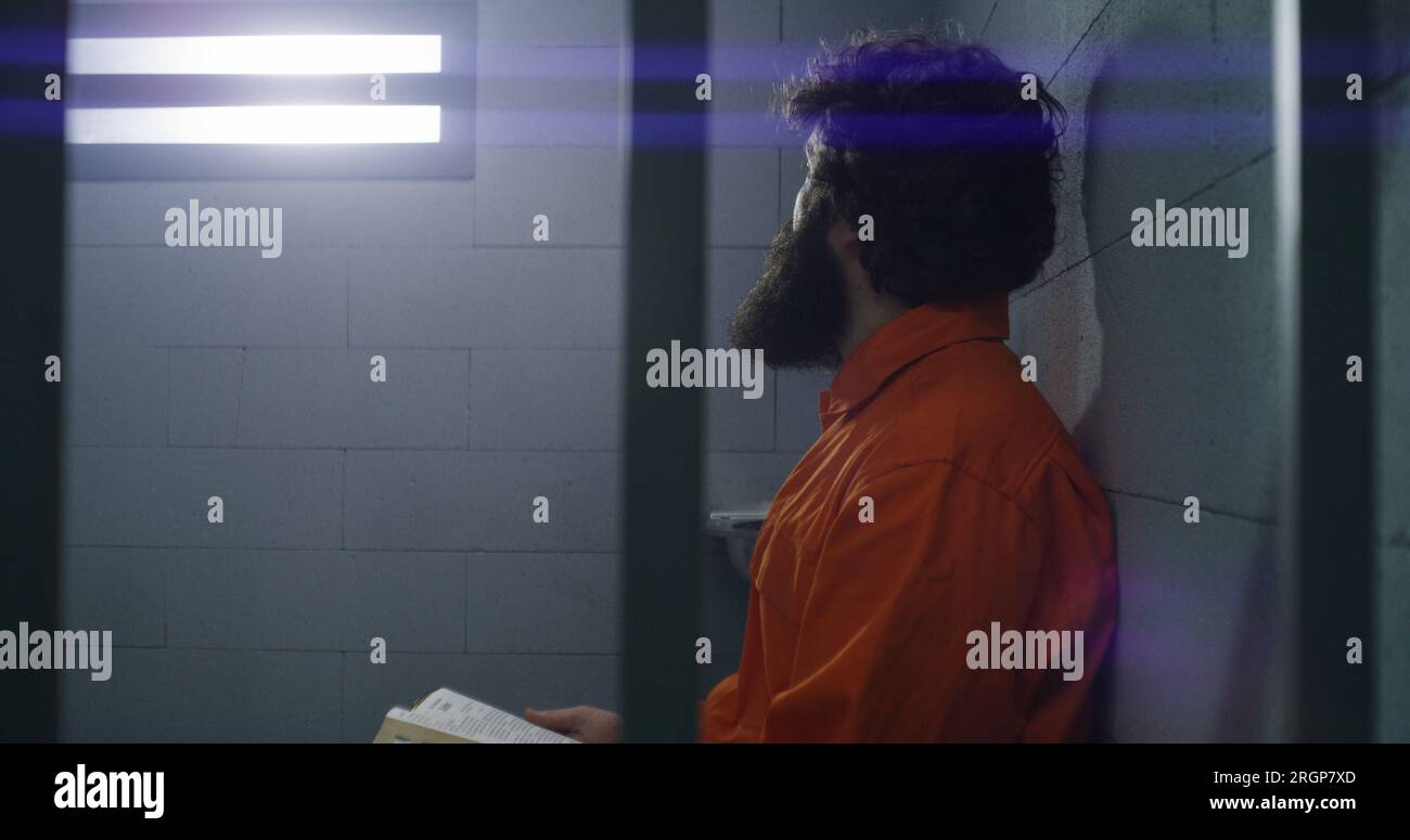 Man sits in jail cell hi-res stock photography and images - Alamy