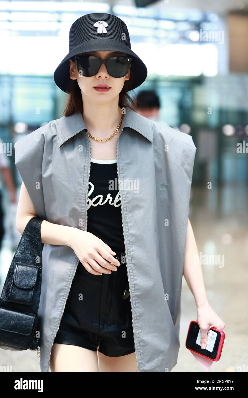 Chinese singer and actress Stephy Qi appears at the airport in Shanghai ...