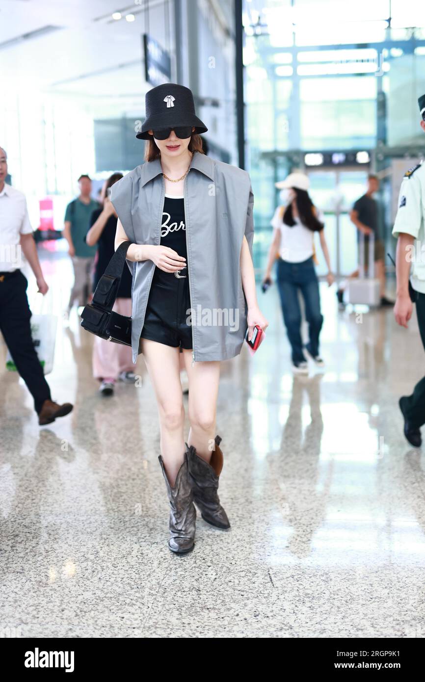 Chinese singer and actress Stephy Qi appears at the airport in Shanghai ...