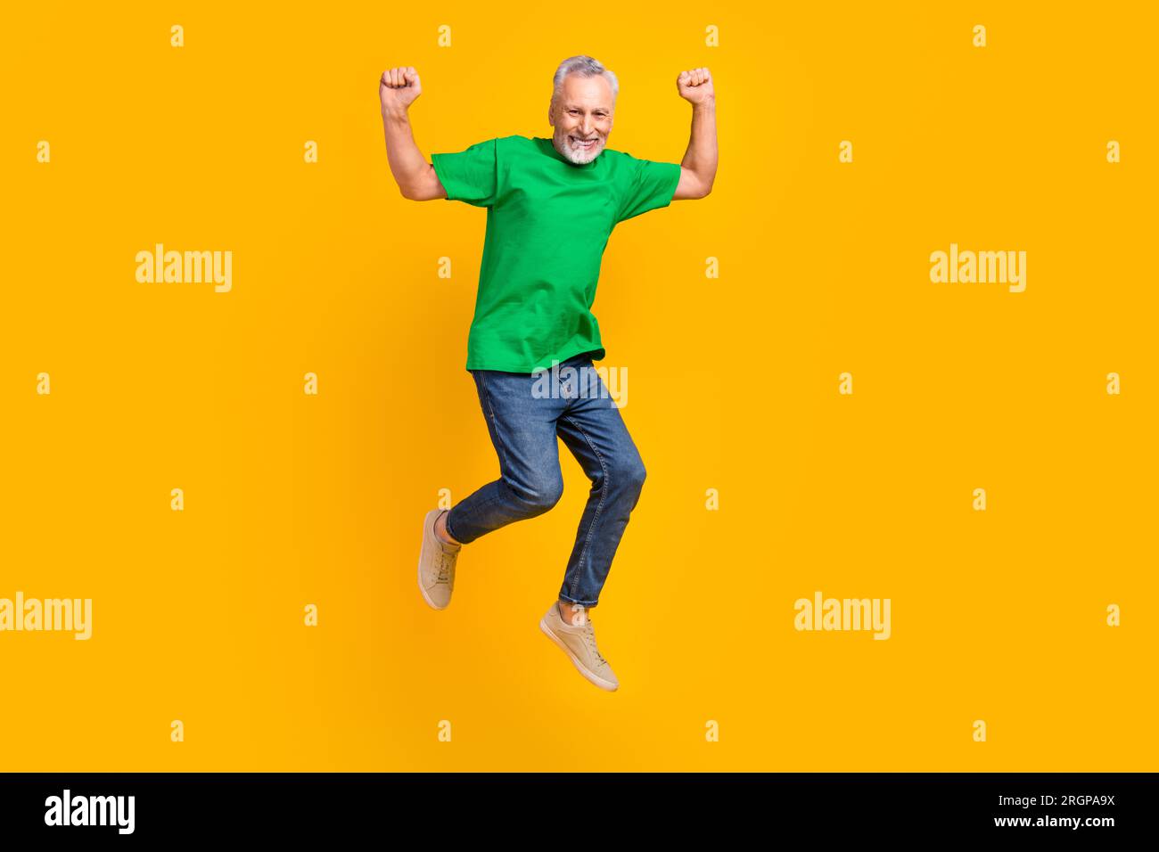 Full length photo of delighted overjoyed man jumping raise fists empty ...