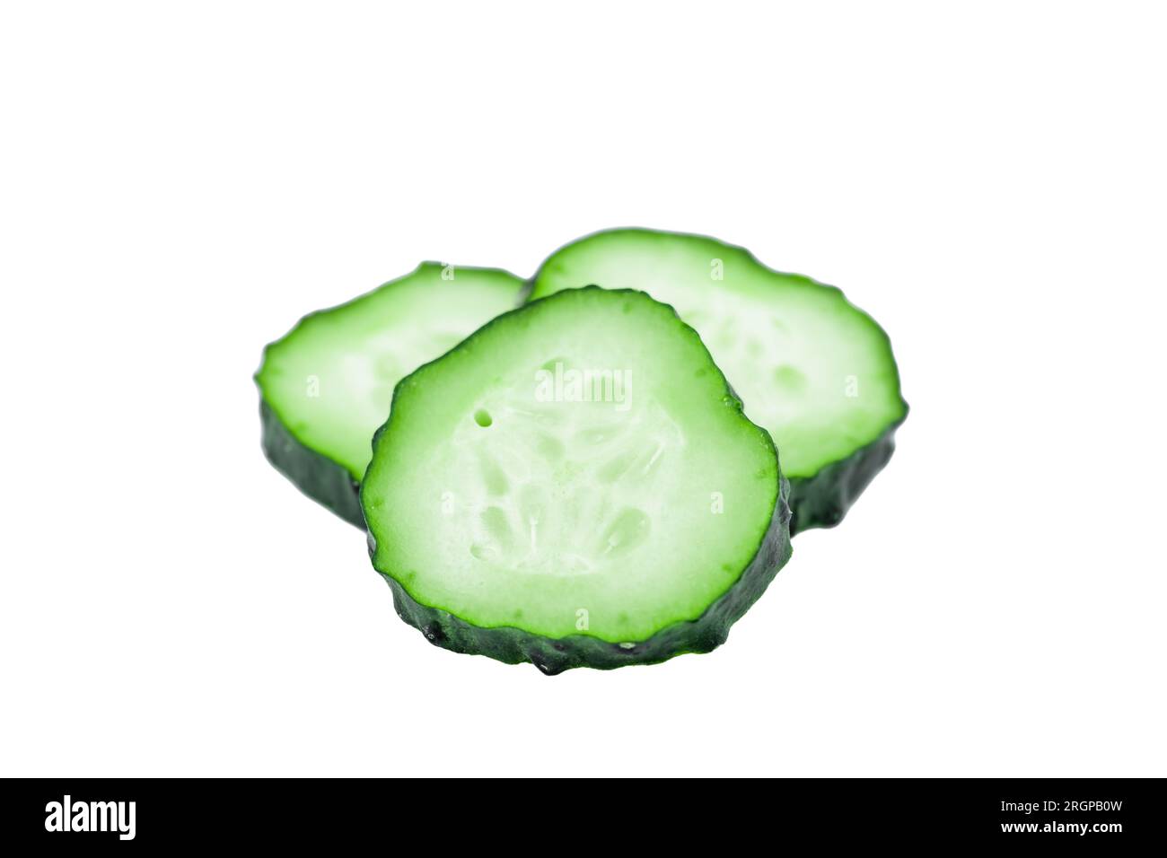 Juicy fresh sliced cucumbers isolated on white background Stock Photo ...