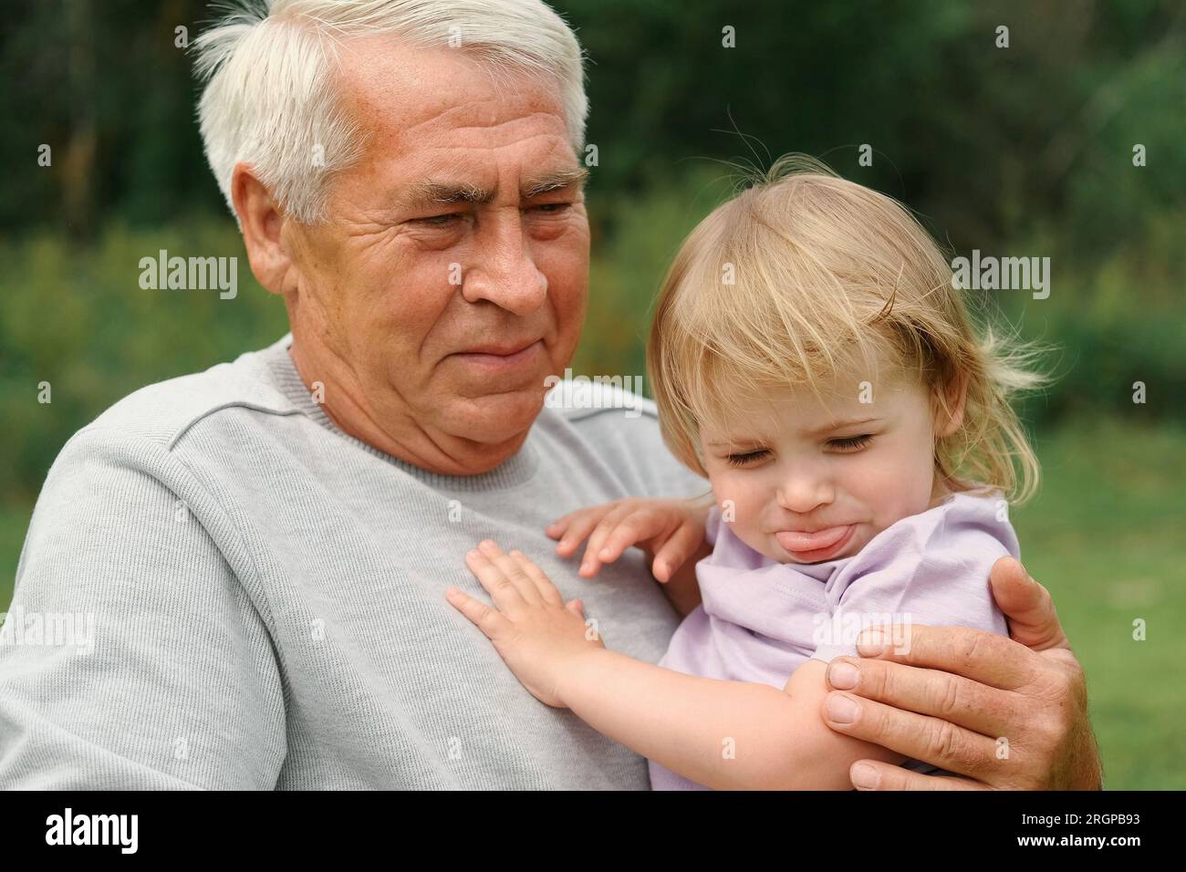 Grandfather and grandchild baby have fun during walk In Park. Happy ...