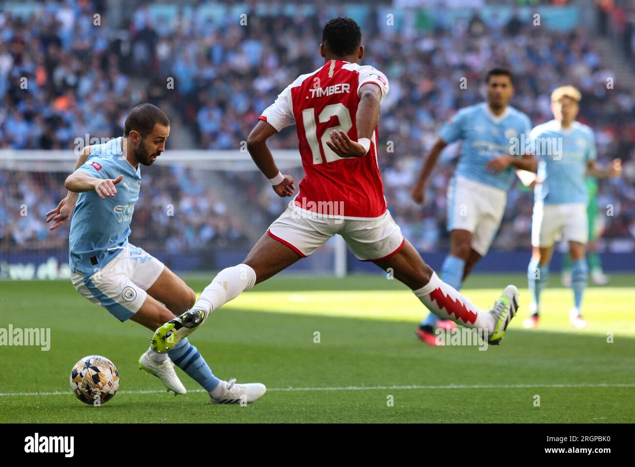 Jurrien Timber of Arsenal looks to block Bernardo Silva of Manchester City - Arsenal v ...