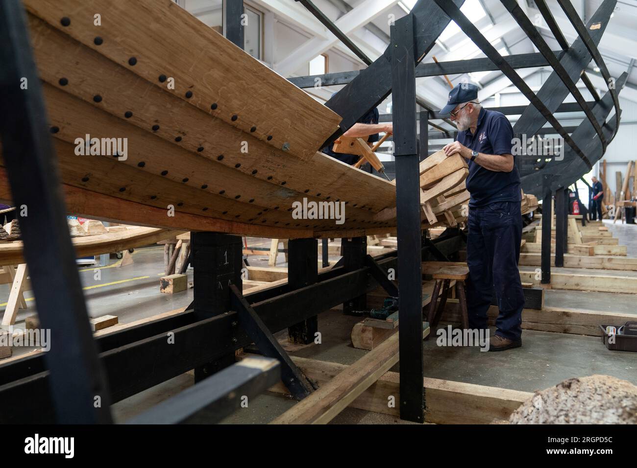 David Steptoe works on the replica of the Sutton Hoo longship, at the ...