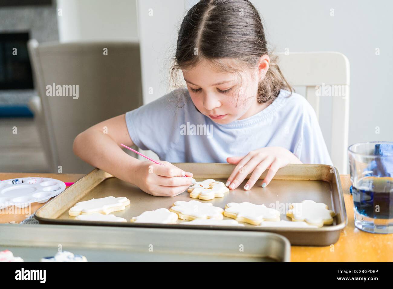 Little Girl Spells 'Sorry' on Iced Sugar Cookies Stock Photo - Alamy
