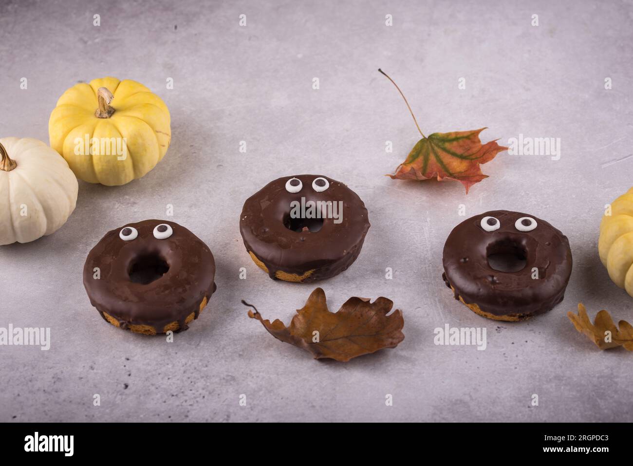 Halloween festive donuts with eyes Stock Photo - Alamy