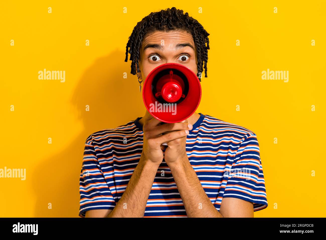 Portrait of impressed person hands hold loudspeaker toa communicate ...