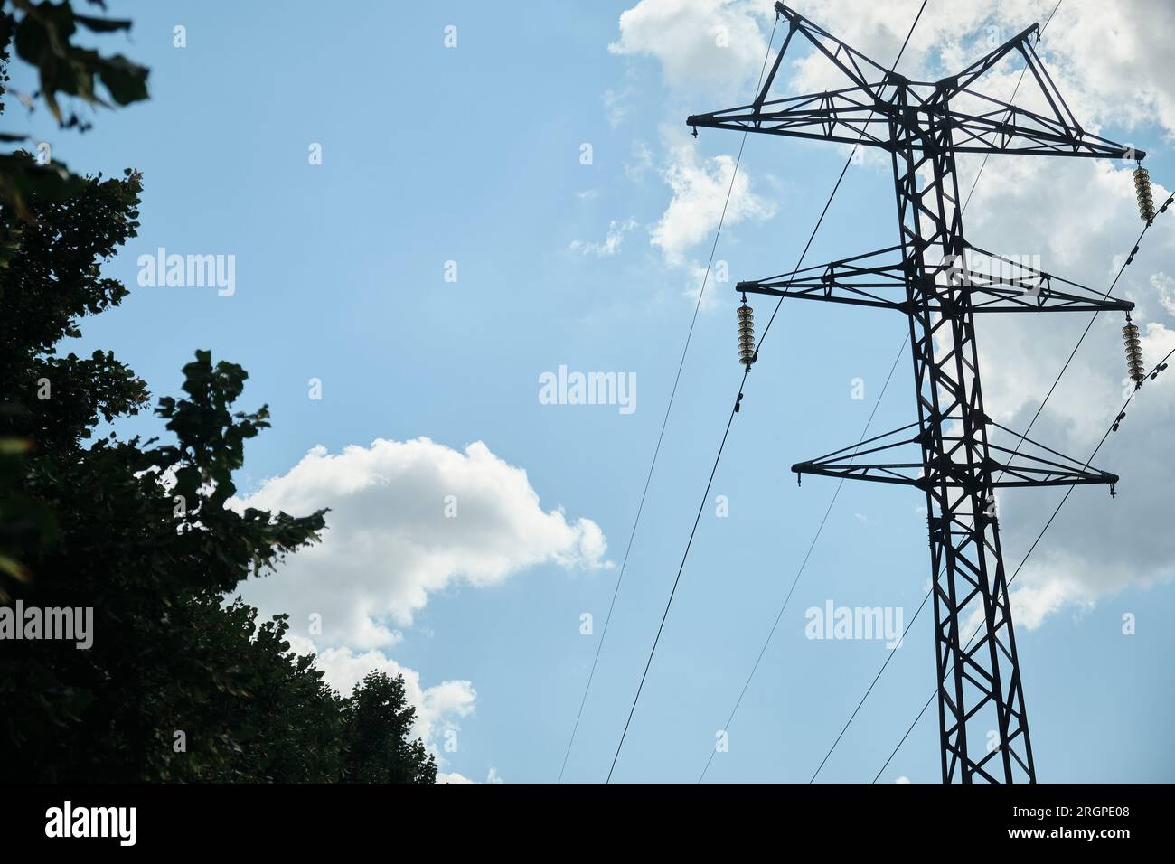 High-voltage power line, electricity pylon, power line mast against the ...