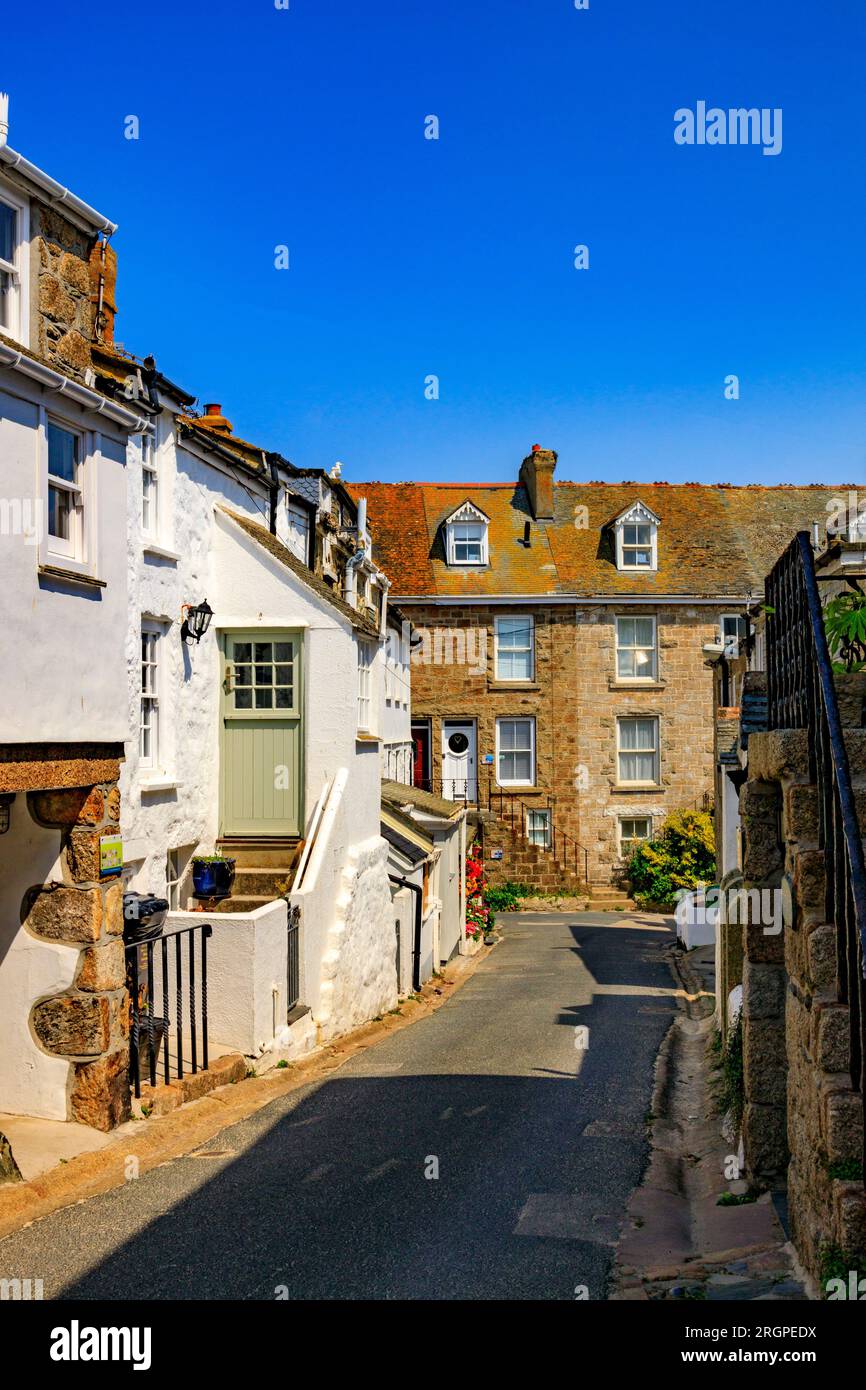 Attractive stone cottages in one of the narrow streets of St Ives ...