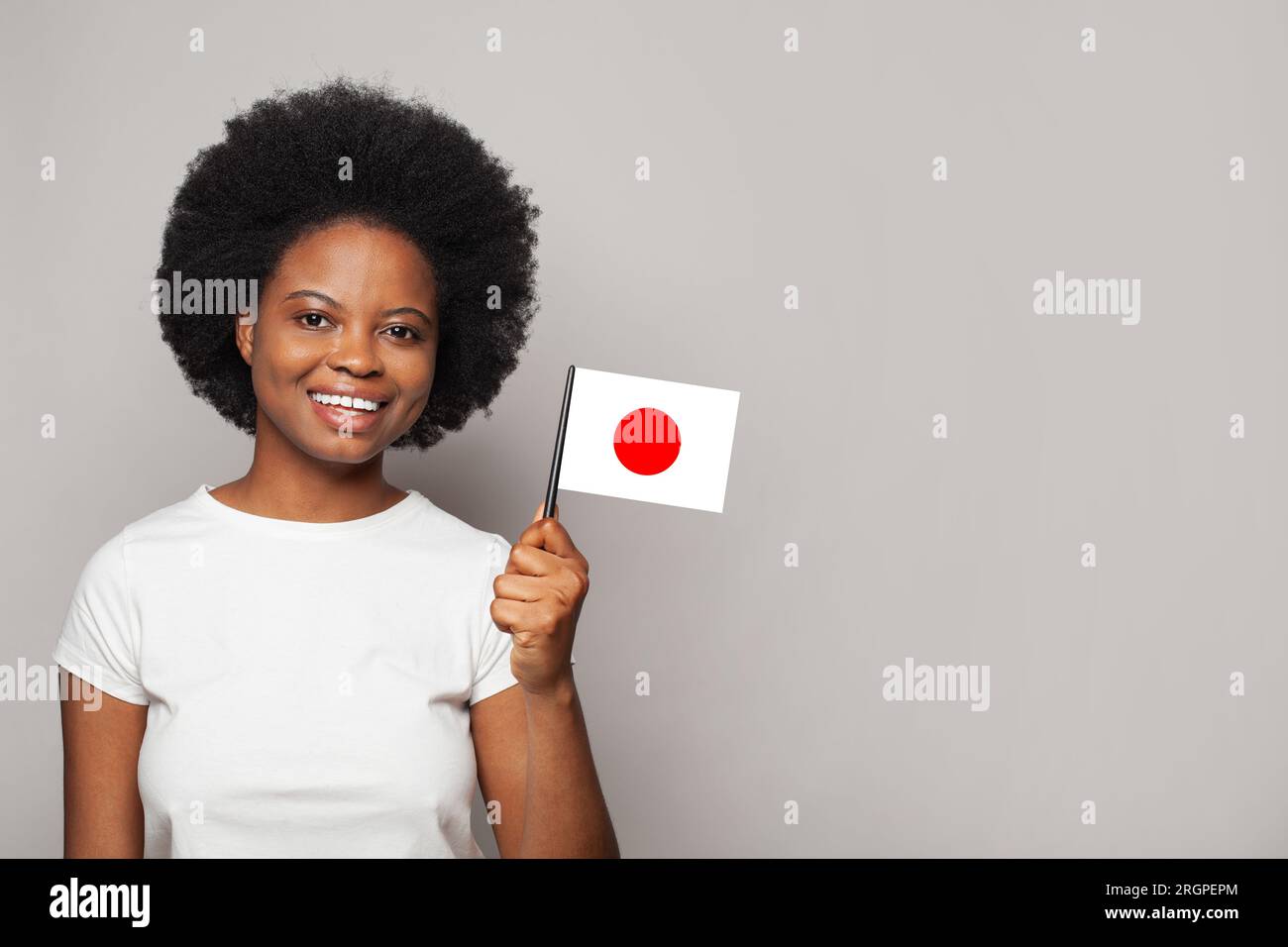 Japanese woman holding flag of Japan Education, business, citizenship ...