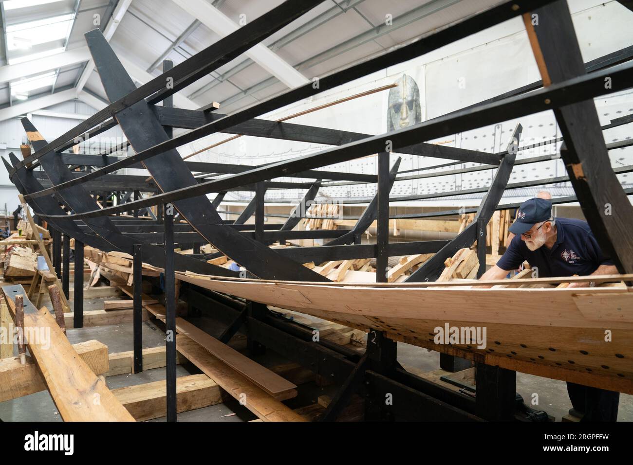 David Steptoe works on the replica of the Sutton Hoo longship, at the ...