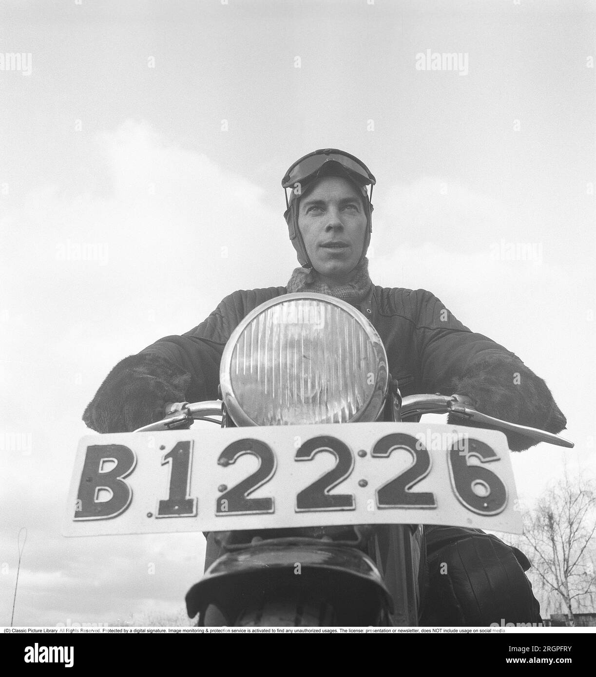 Motorcyclist in the 1950s. A young man dressed in the typical way the ...