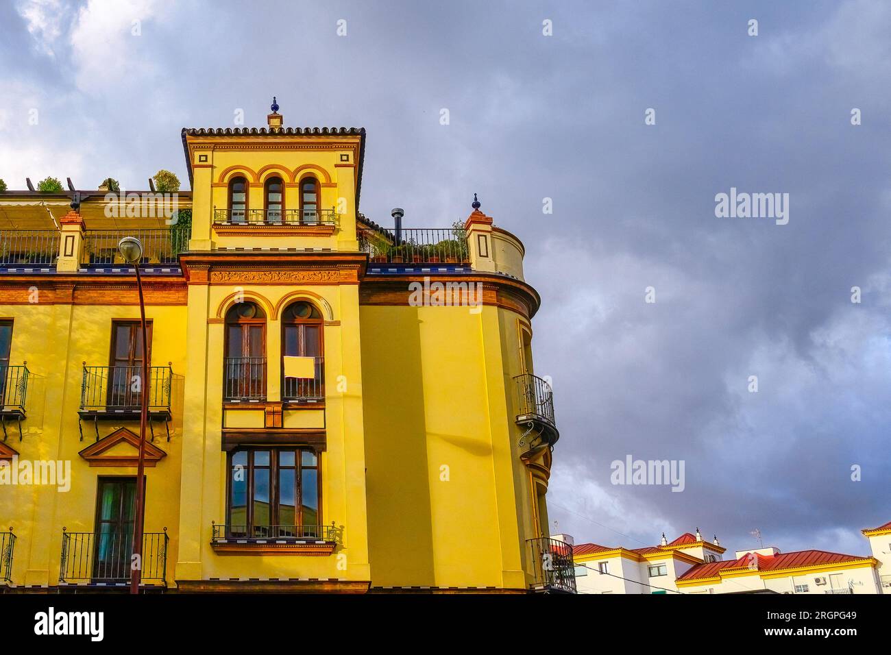 Seville, Spain, Colonial style building facade in an overcast sky ...