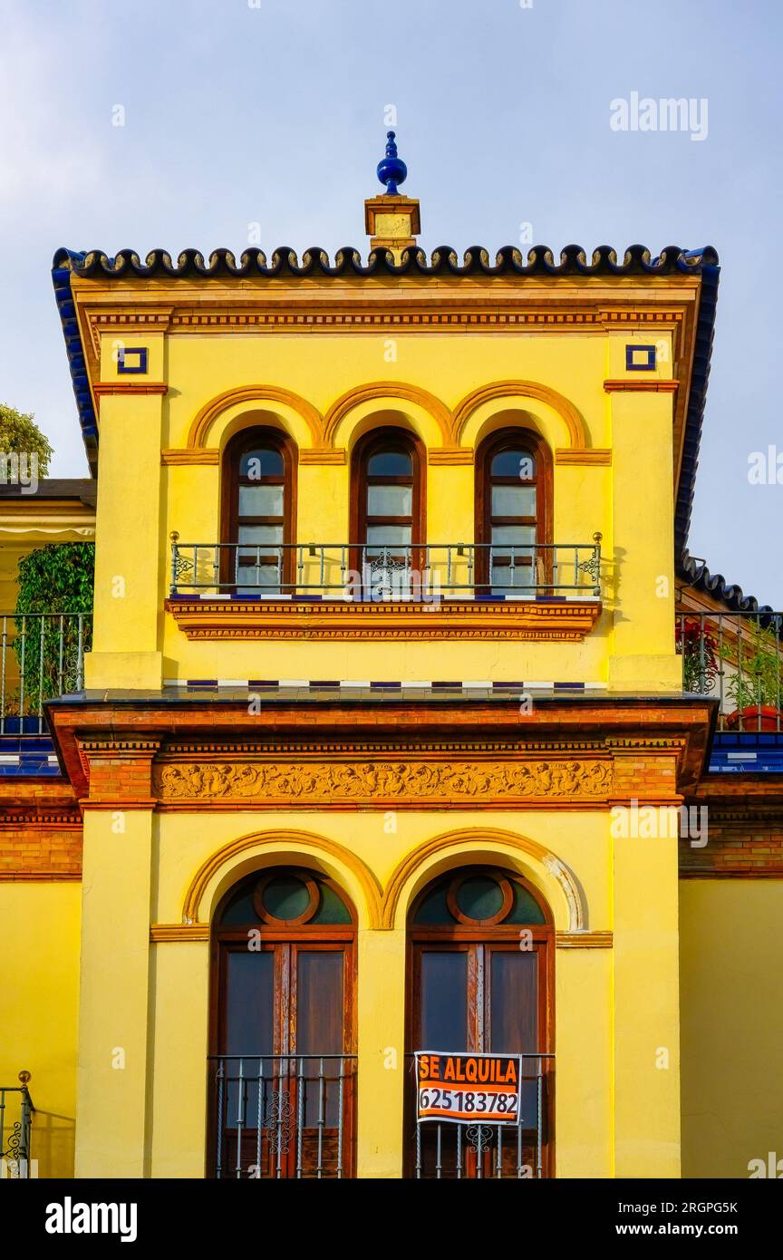 Seville, Spain, Colonial style building facade in an overcast sky ...