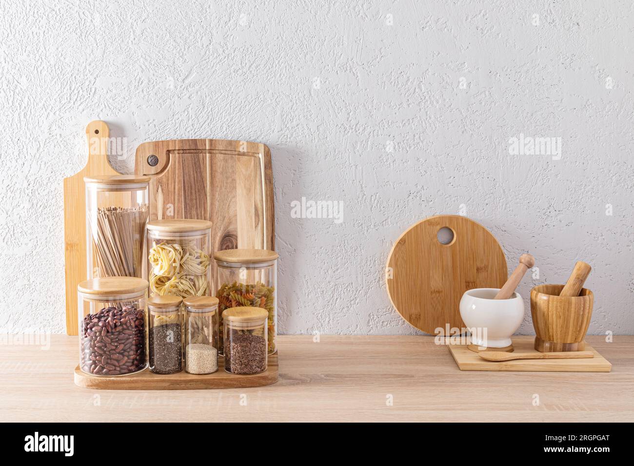 eco-friendly tools on the kitchen wooden countertop against a gray ...