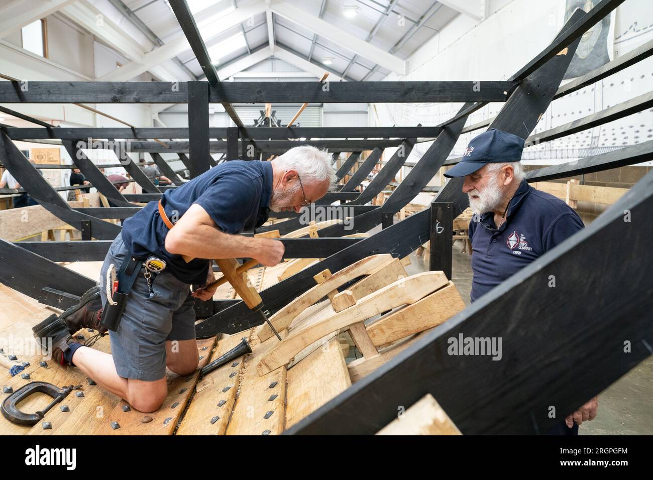 David Steptoe works on the replica of the Sutton Hoo longship, at the Longshed in Woodbridge ...