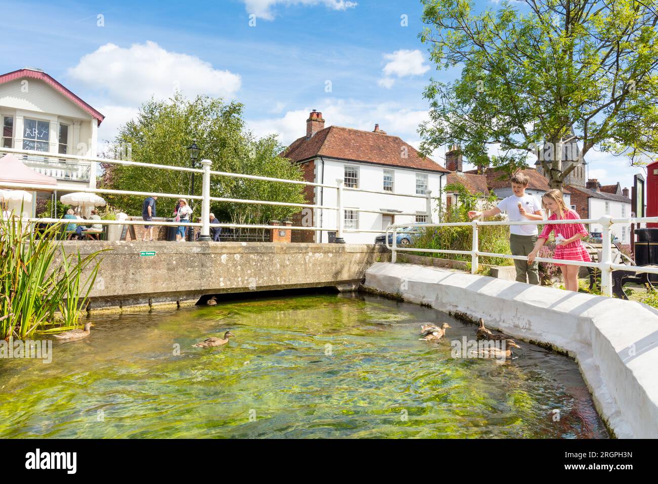 Stockbridge, High Street, Hampshire, Grandchildren Feeding Fish & Ducks ...