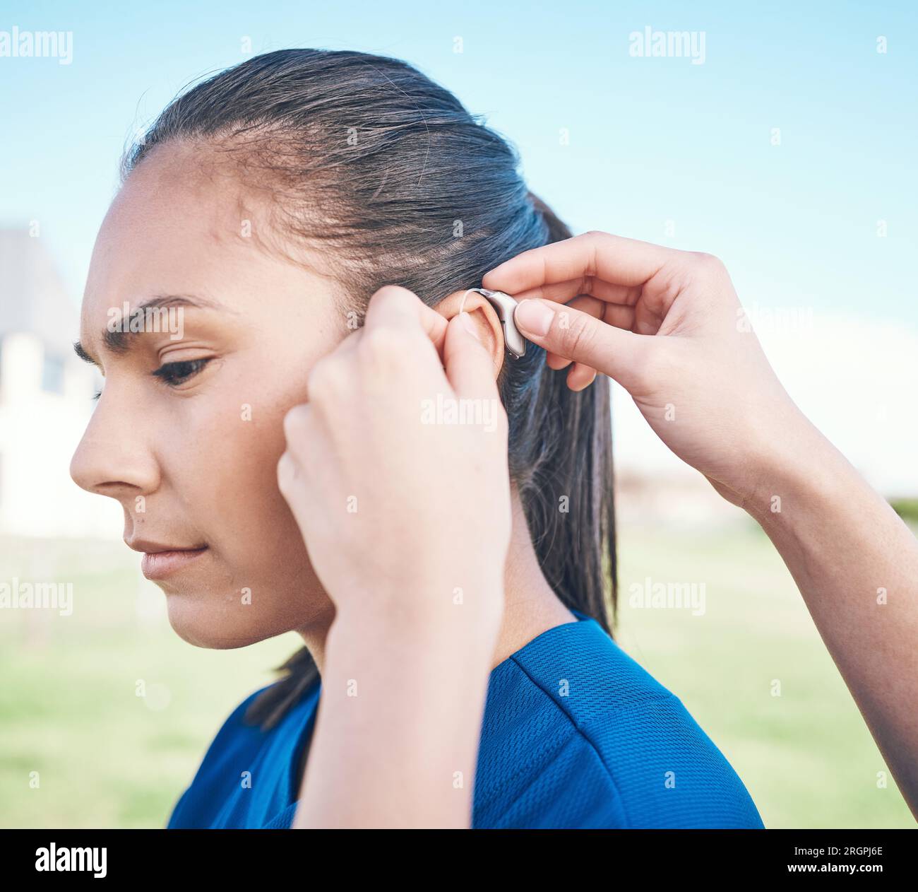 Hands, profile and woman in hearing aid, ear and sound amplifier at ...