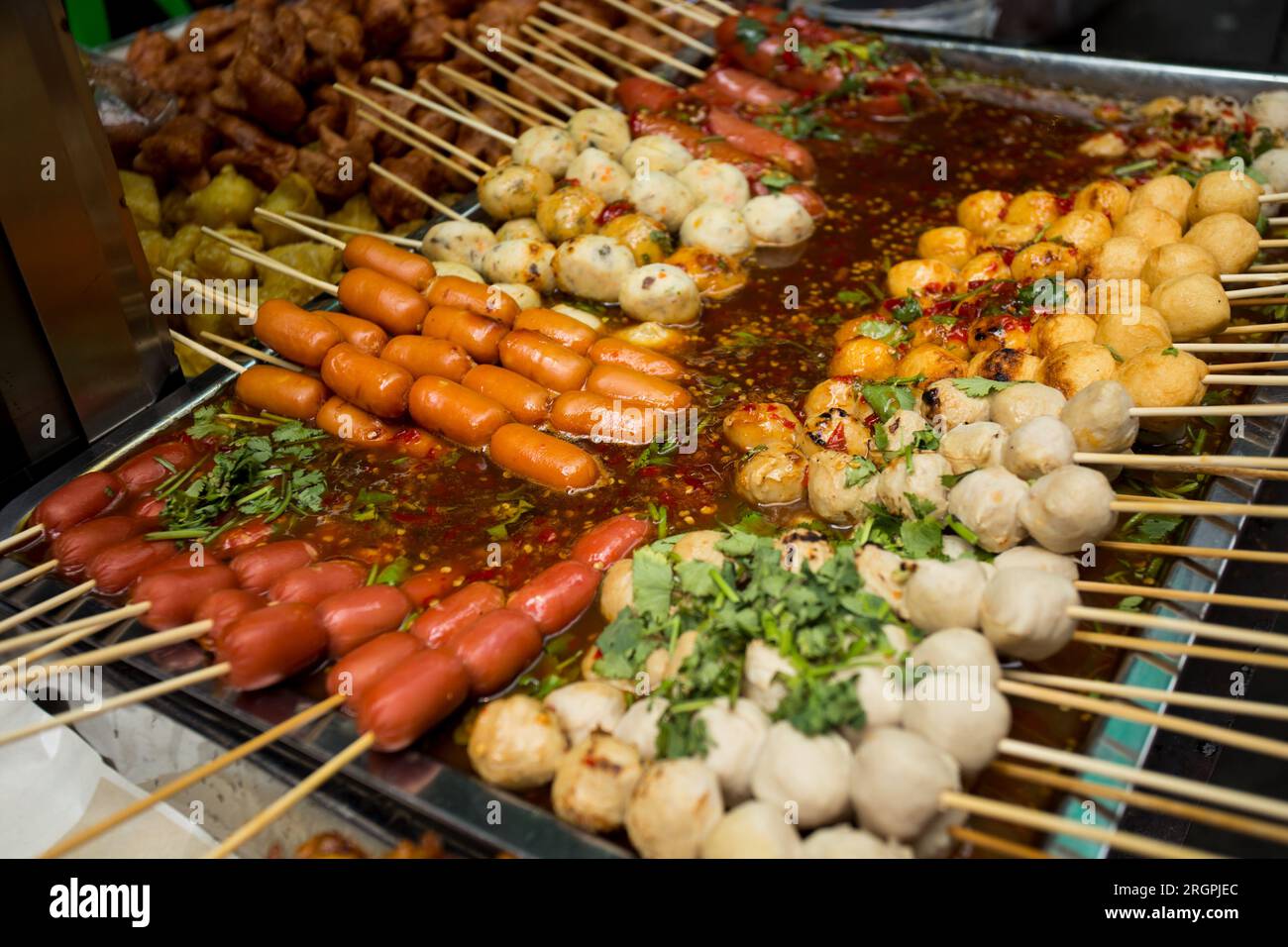 Fried fish starters at a street food stall in the city of Bangkok in ...