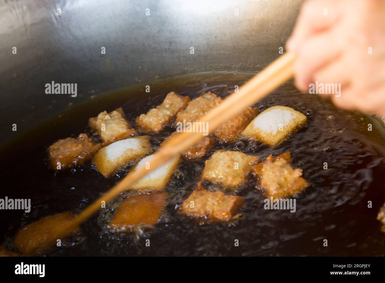 Fried fish starters at a street food stall in the city of Bangkok in ...