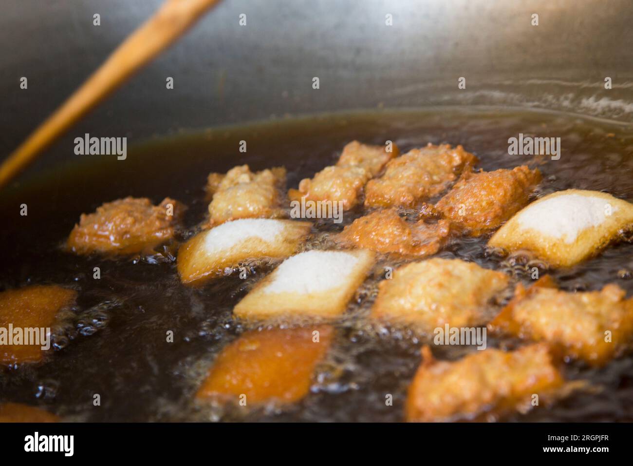 Fried fish starters at a street food stall in the city of Bangkok in ...