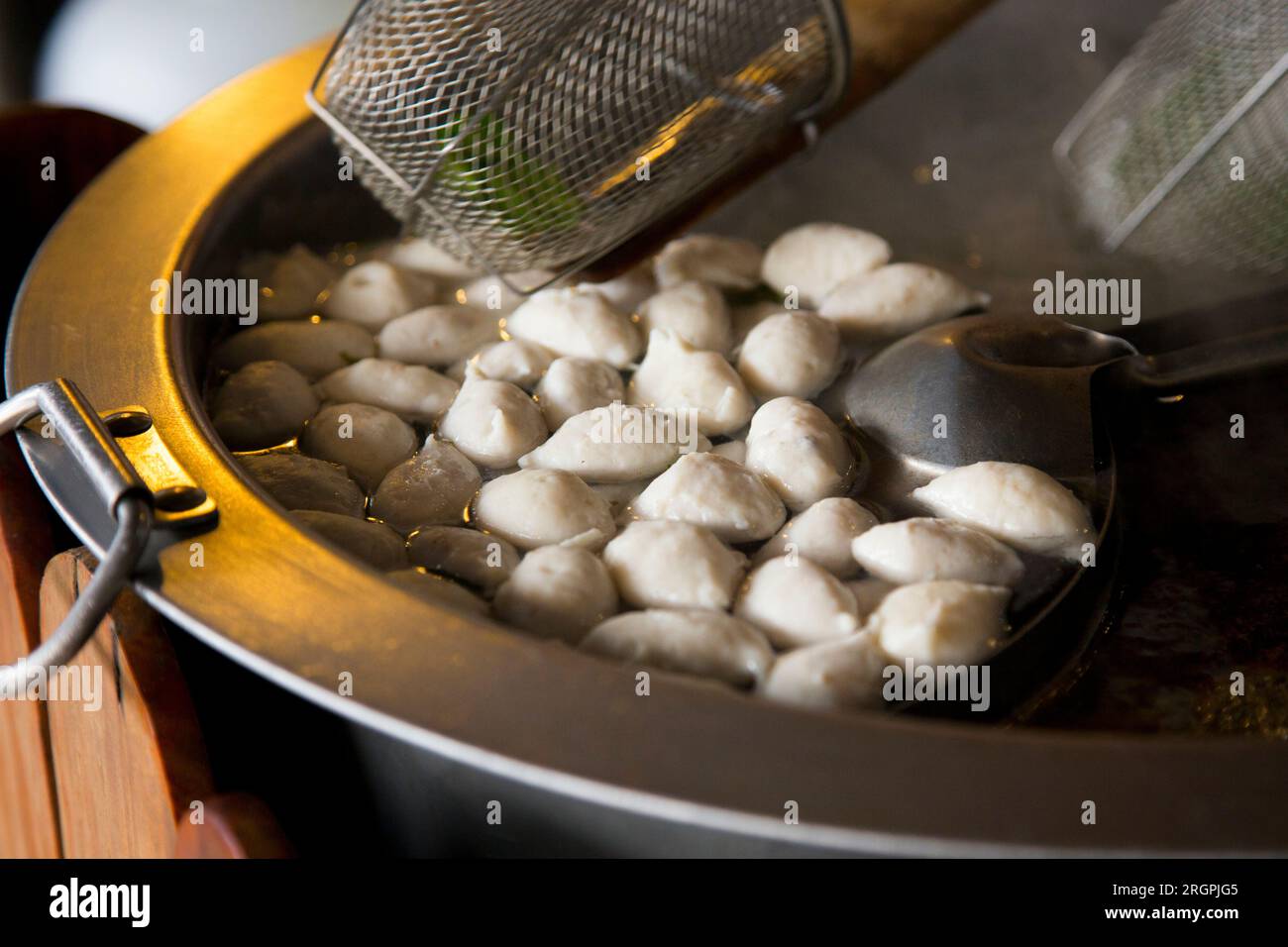 Fried fish starters at a street food stall in the city of Bangkok in ...