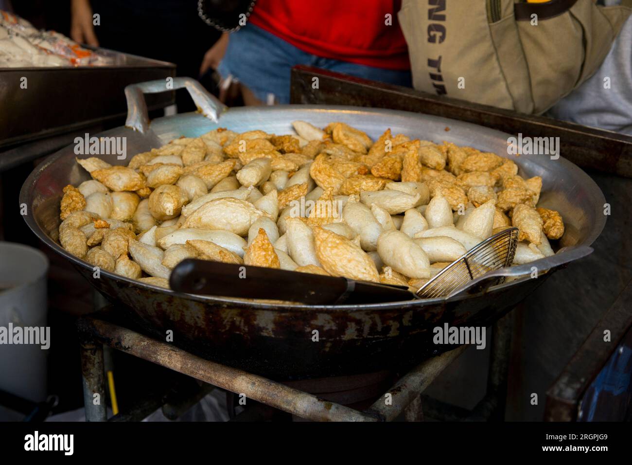 Fried fish starters at a street food stall in the city of Bangkok in ...