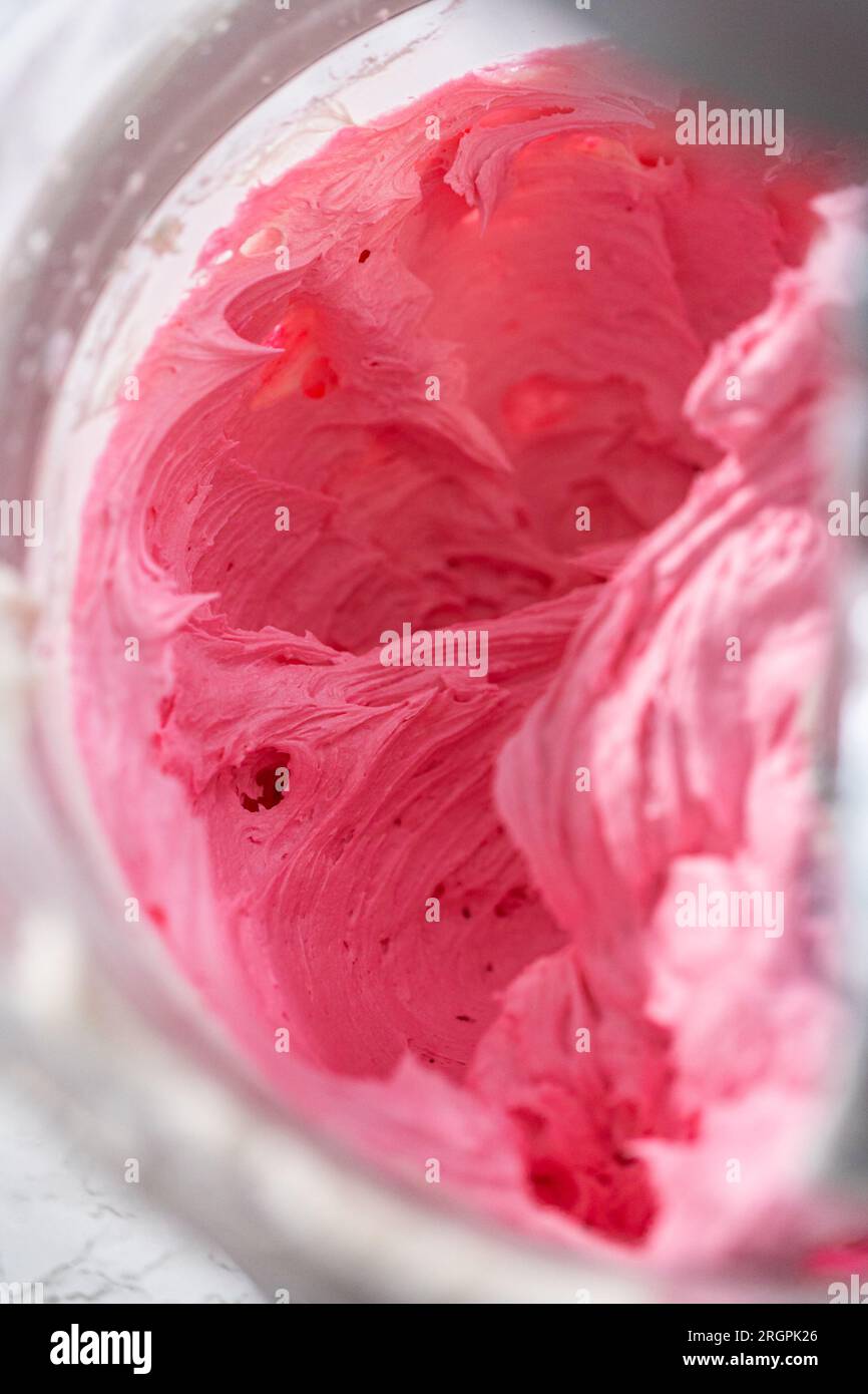 Mini Vanilla Cupcakes with Pink Buttercream Frosting Stock Photo - Alamy