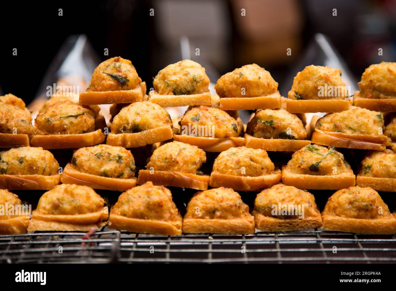 Fried fish starters at a street food stall in the city of Bangkok in ...
