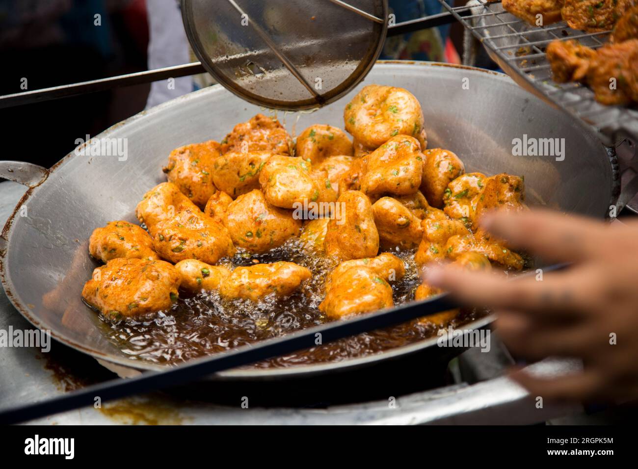 Fried fish starters at a street food stall in the city of Bangkok in ...
