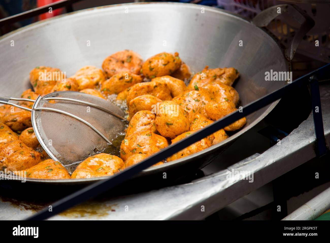 Fried fish starters at a street food stall in the city of Bangkok in ...