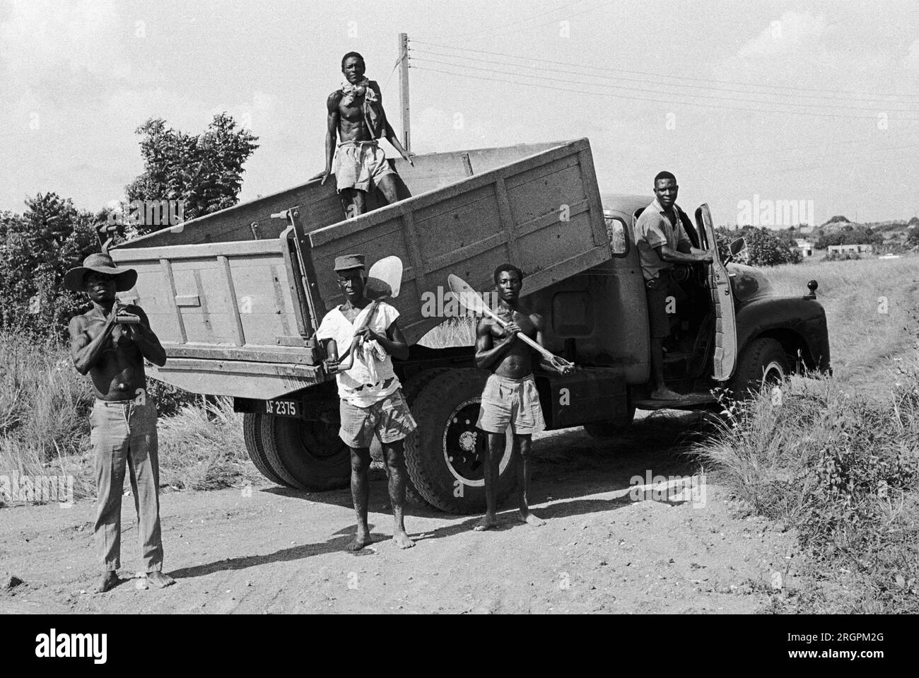 Gang of road workers. Winneba, Ghana Stock Photo - Alamy
