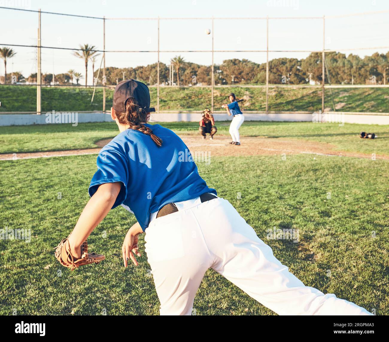 Female athlete pitching on grass hi-res stock photography and images ...